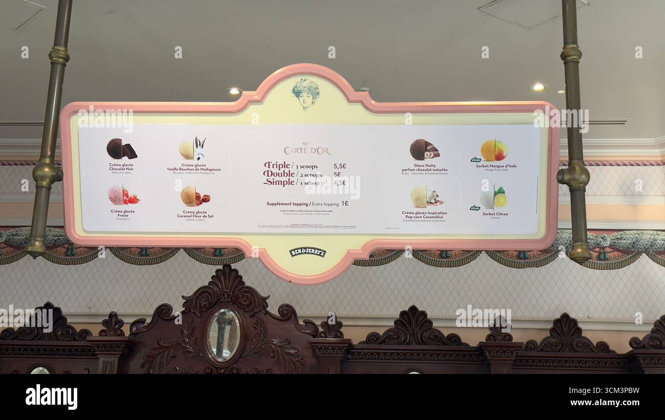 An ice cream menu board displays various flavors, scoop options, and ...