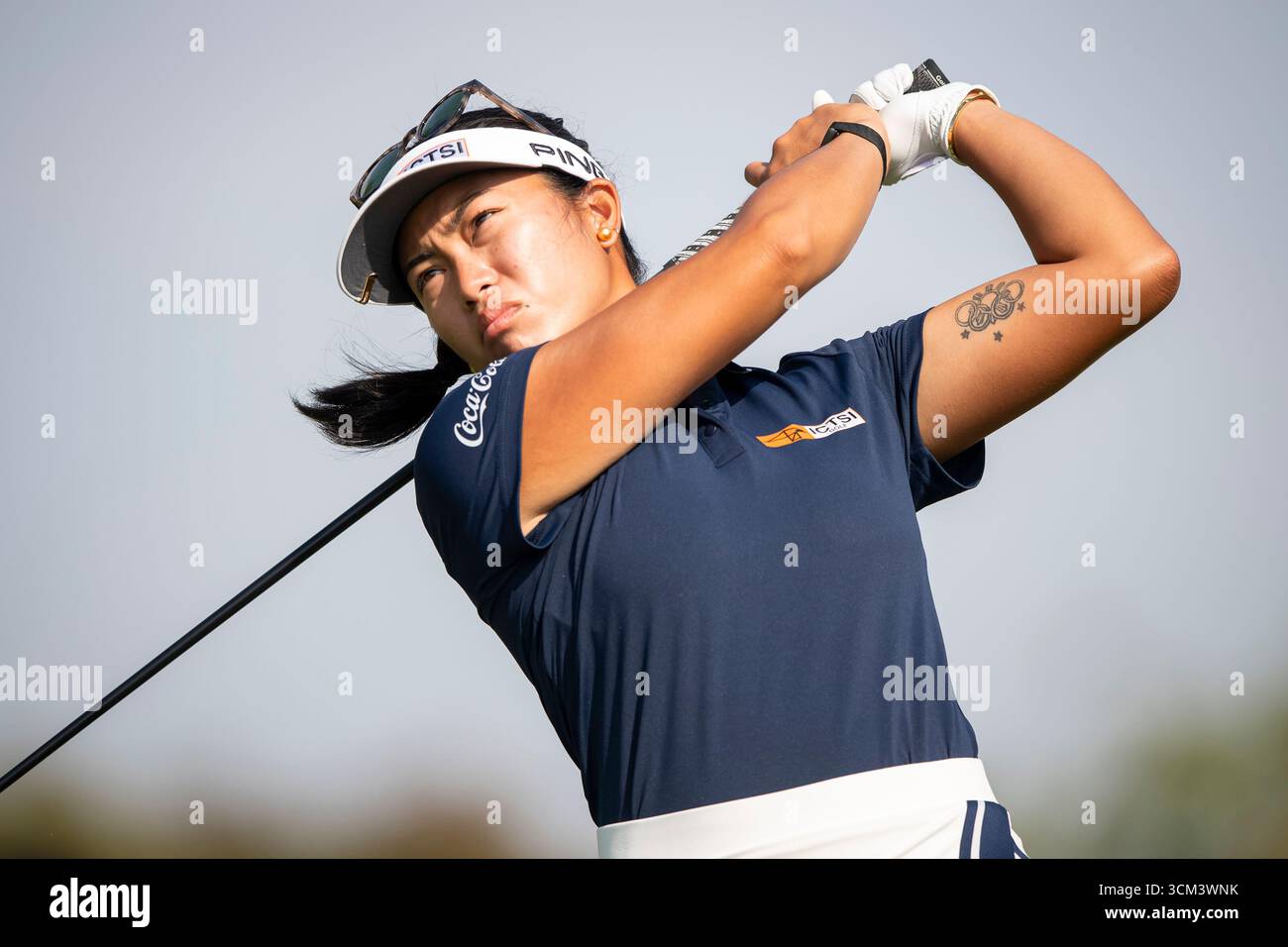 Bianca Pagdanganan, of the Philippines, tees off on the first hole ...
