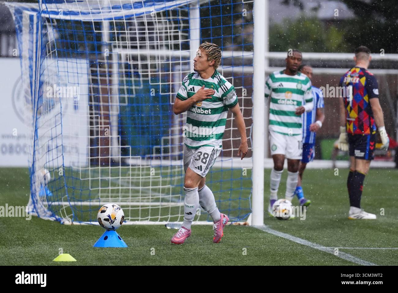 Celtic's Daizen Maeda (left) celebrates after scoring his sides first ...
