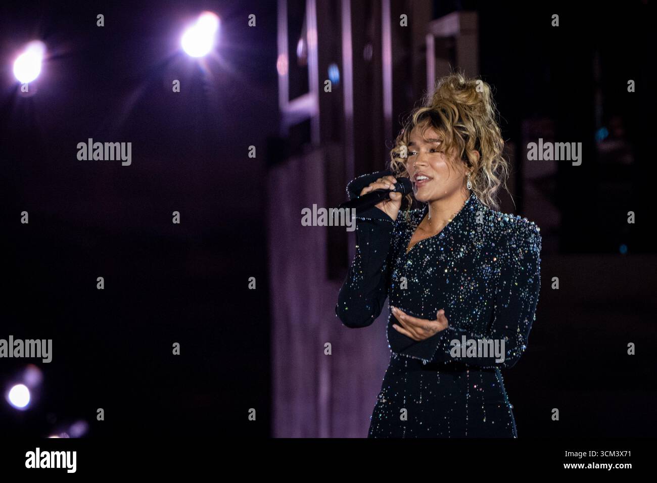 Karol G performs on the stage during the “Grace For The World” event at ...