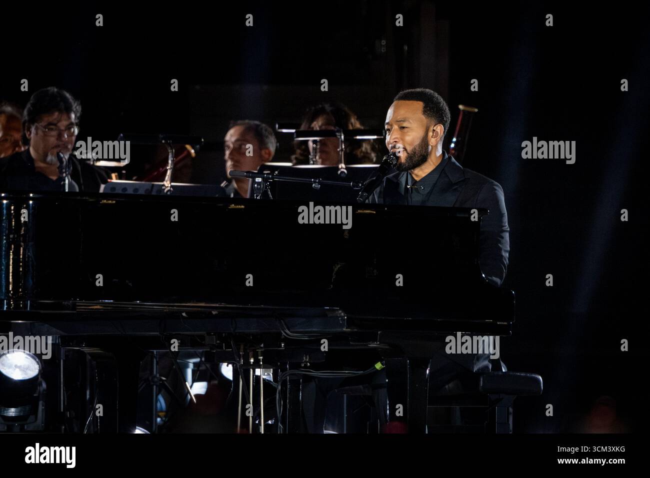 John Legend performs on the stage during the “Grace For The World ...