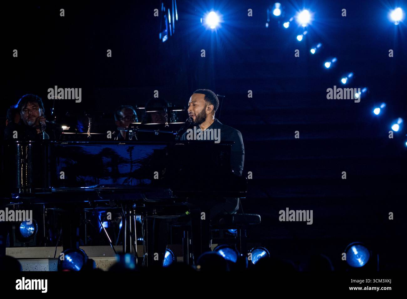 John Legend performs on the stage during the “Grace For The World ...