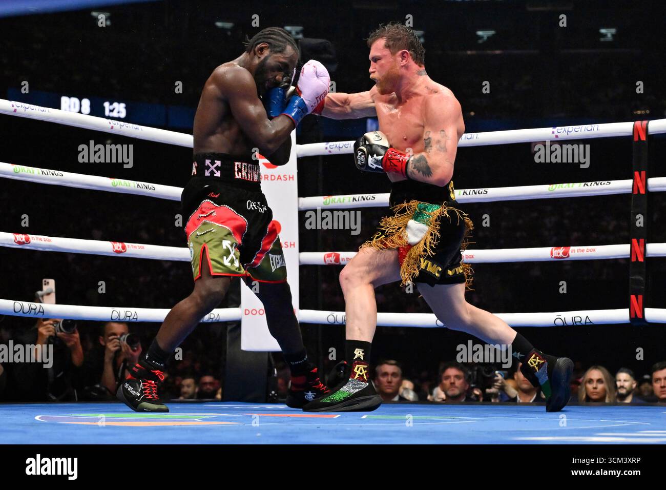 Canelo Alvarez, right, connects with Terence Crawford during an ...