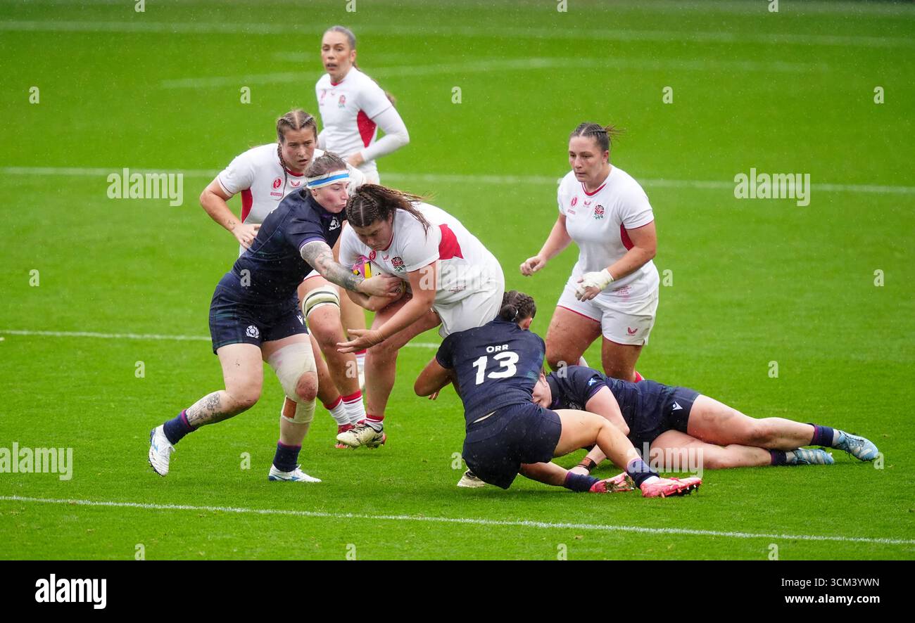 England's Maud Muir is tackled by Scotland's Emma Orr during the Women ...