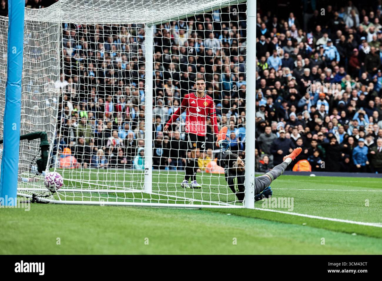 Phil Foden of Manchester City scores to make it 1-0 during the Premier ...