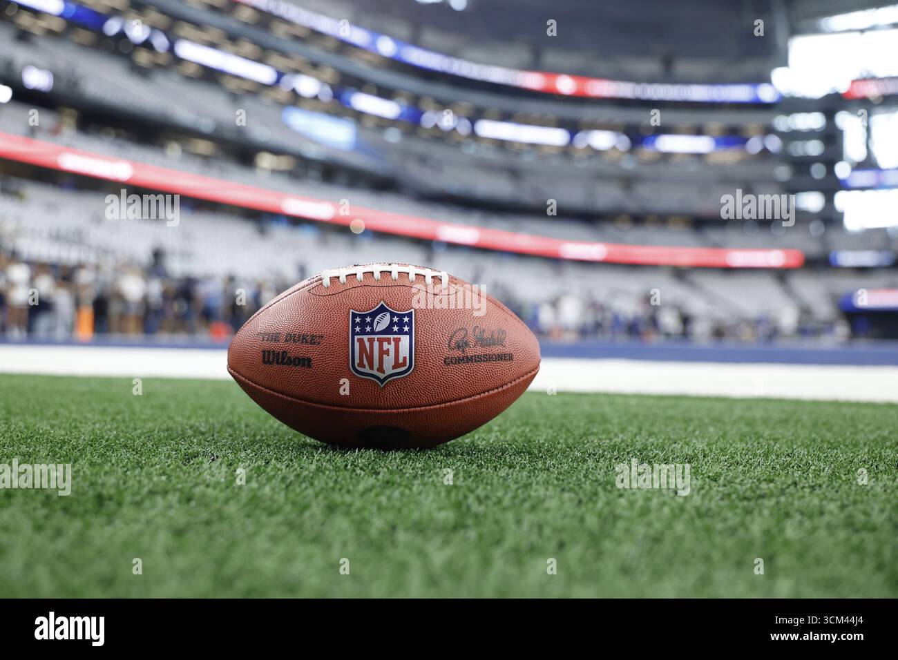 A closeup detailed photo of a Wilson NFL football "the duke" on the ...