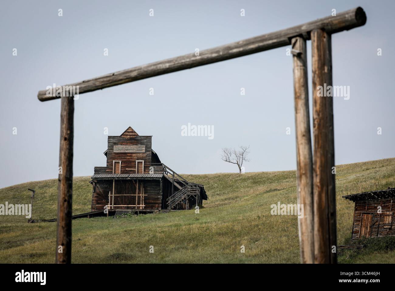A Western movie set building is framed by an entrance gate on the 5000 ...