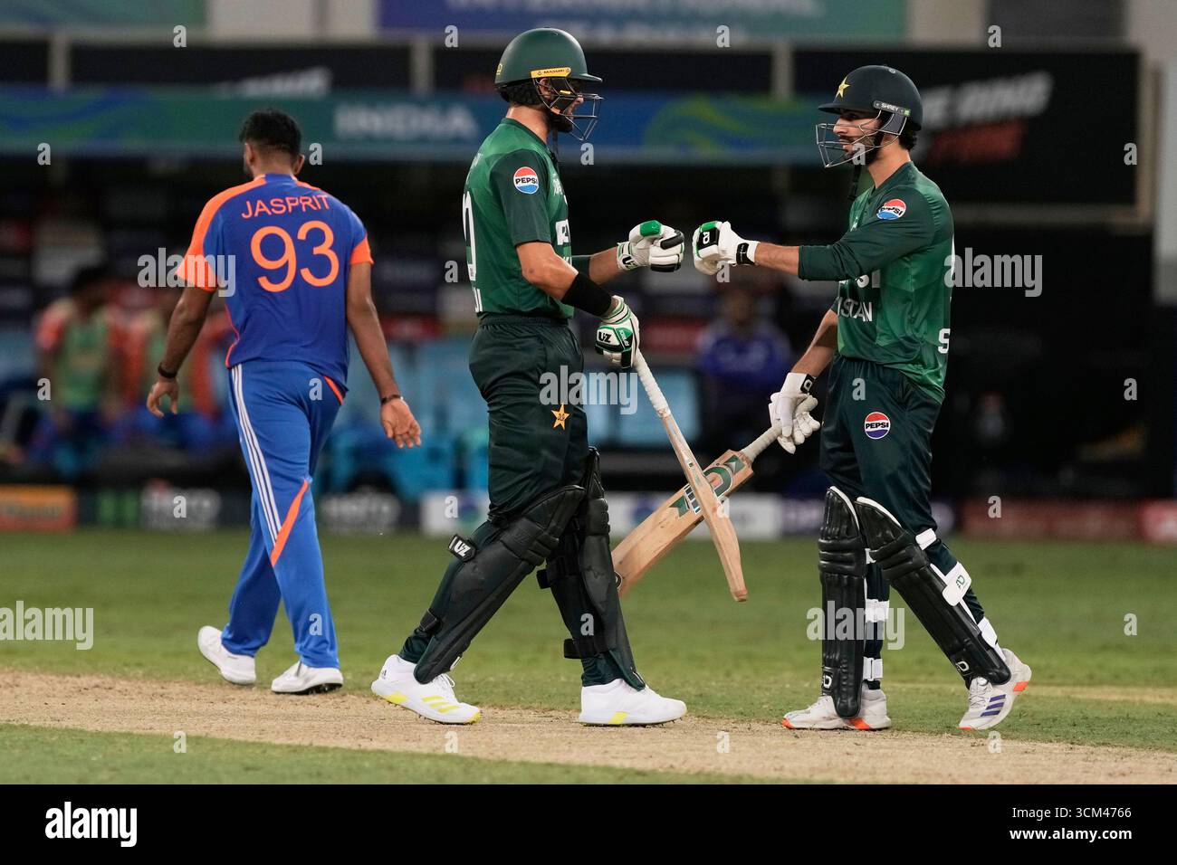 Pakistan's Sufiyan Muqeem, right, celebrates with batting partner ...