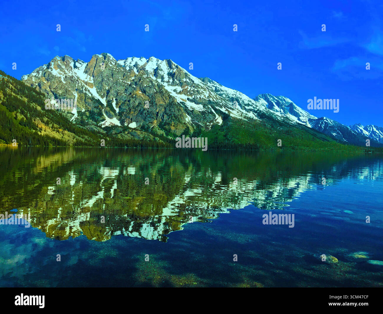 Grand Teton National Park, Wyoming; sunset alpenglow on the jagged ...
