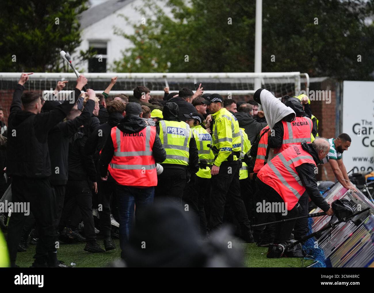 Celtic fans leave their seats following their teams late winning goal ...