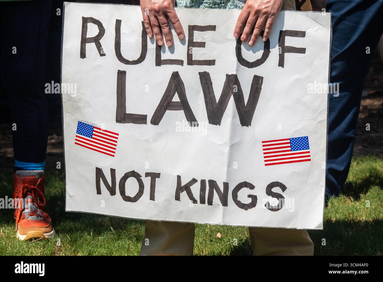 Atlanta, GA / USA - September 1, 2025: Man holds sign reading "Rule of ...