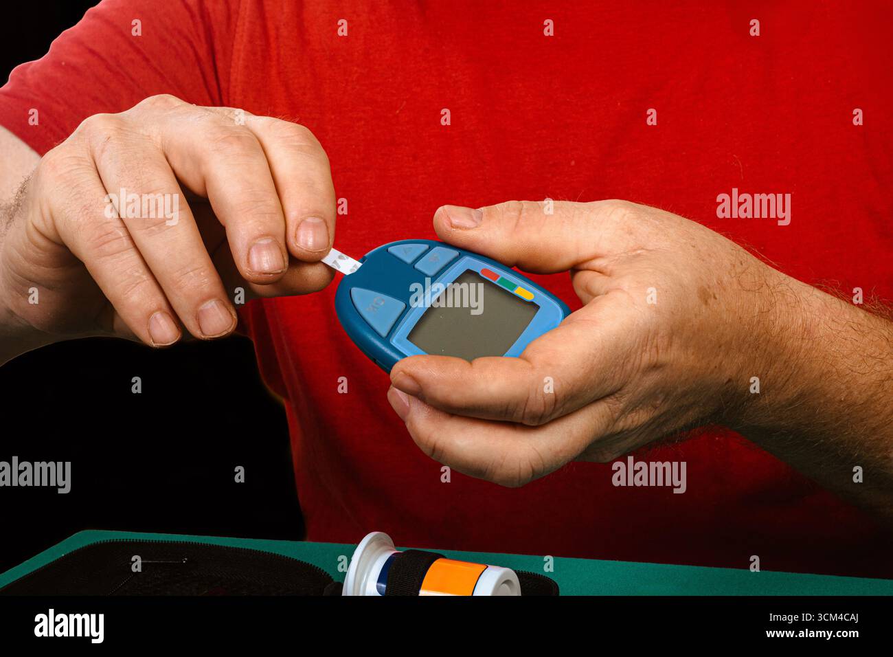 Man inserting strip glucose hi-res stock photography and images - Alamy