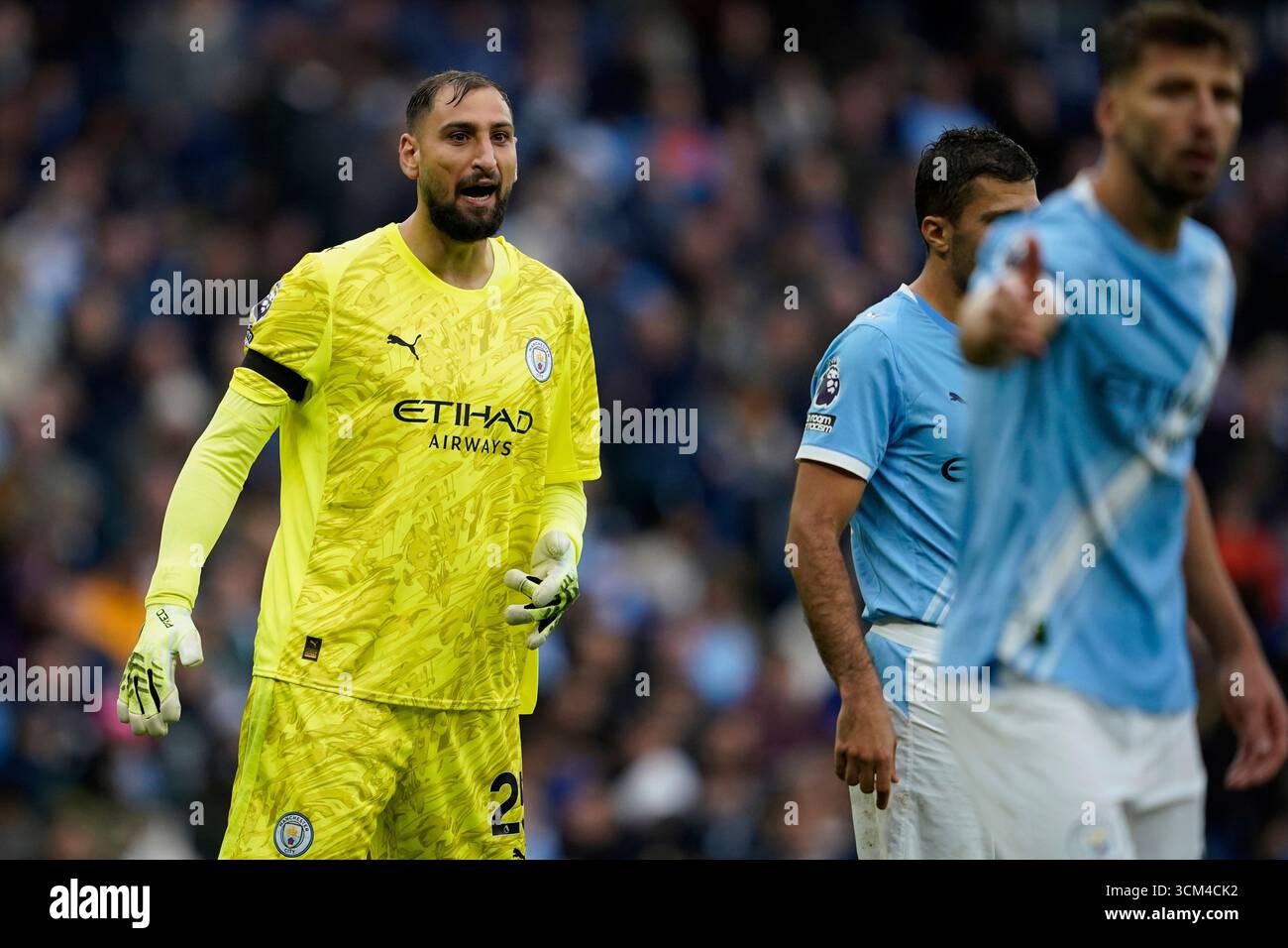 Manchester City's goalkeeper Gianluigi Donnarumma talks to his players ...
