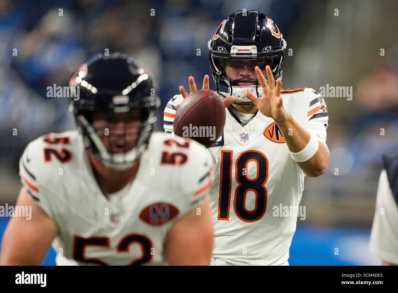 Chicago Bears quarterback Caleb Williams (18) and center Drew Dalman (52) warm up before an NFL ...