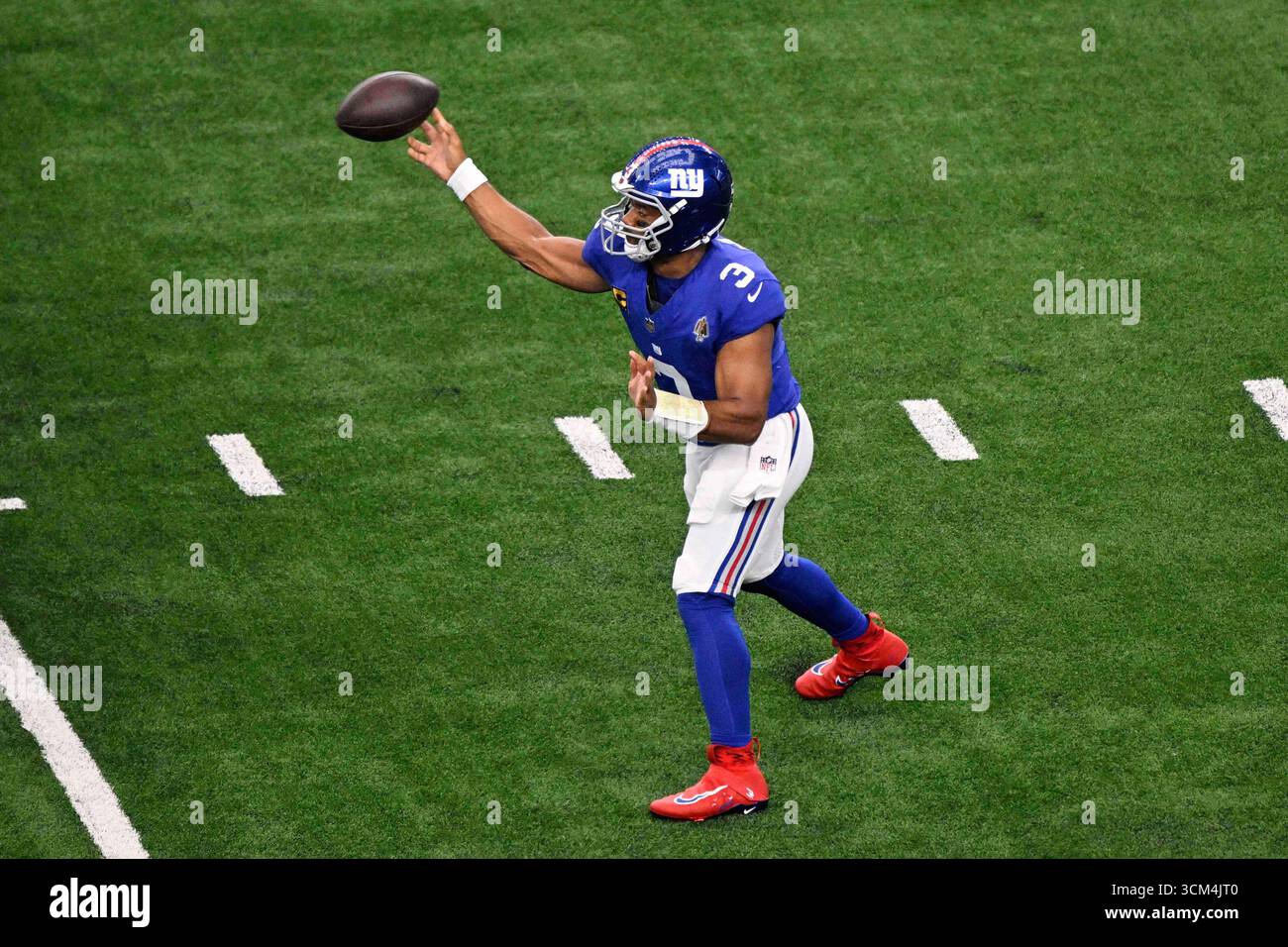 New York Giants' Russell Wilson throws a pass in the first half of an ...
