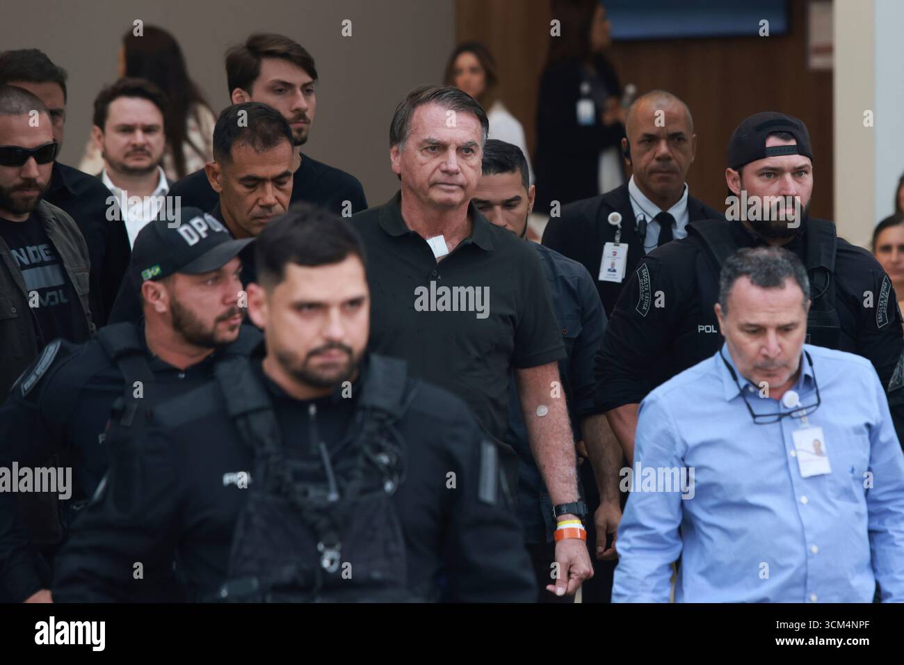 Former President Jair Bolsonaro, center, temporarily allowed out of ...