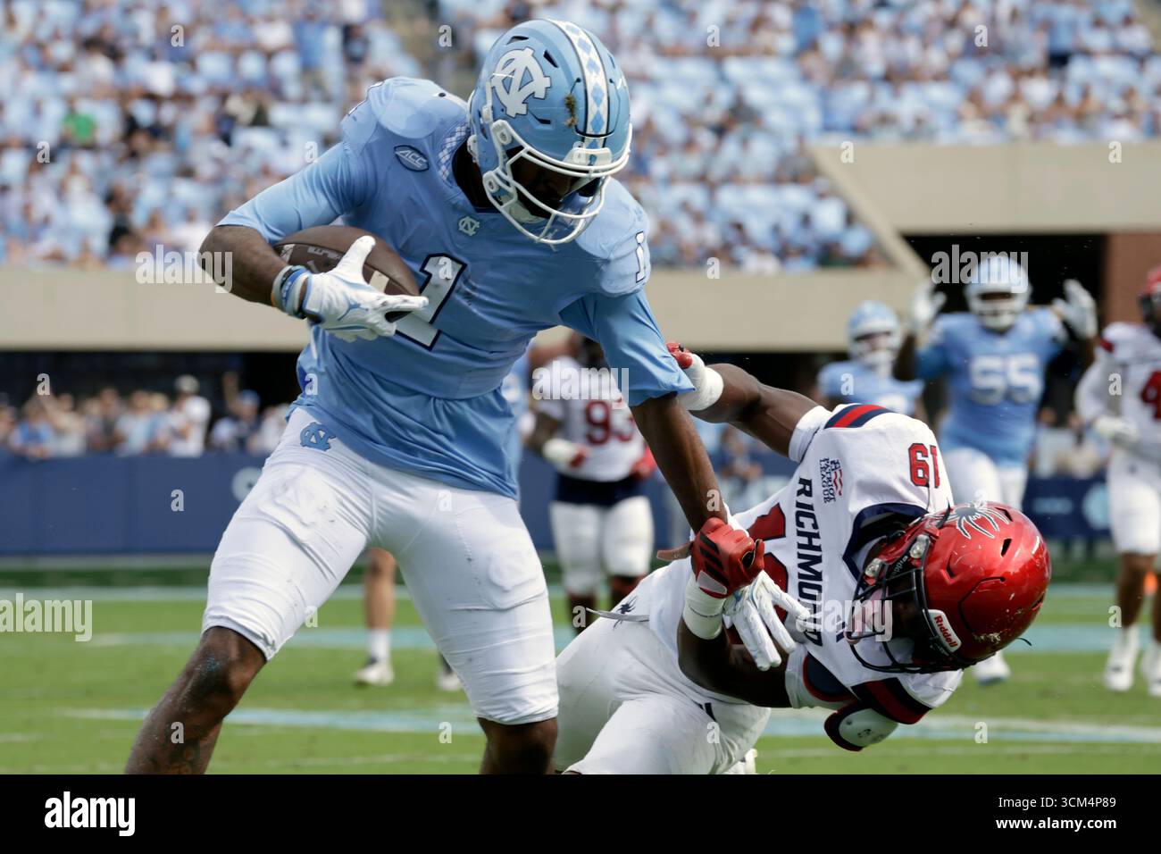 North Carolina wide receiver Jordan Shipp (1) stiff-arms Richmond ...