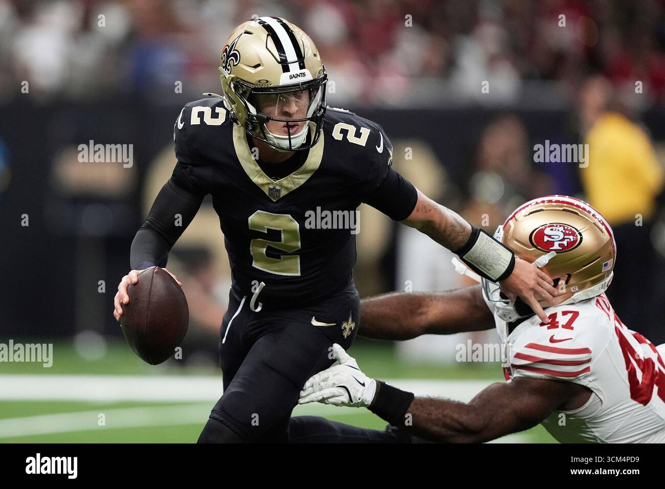 New Orleans Saints quarterback Spencer Rattler (2) rolls out as San ...