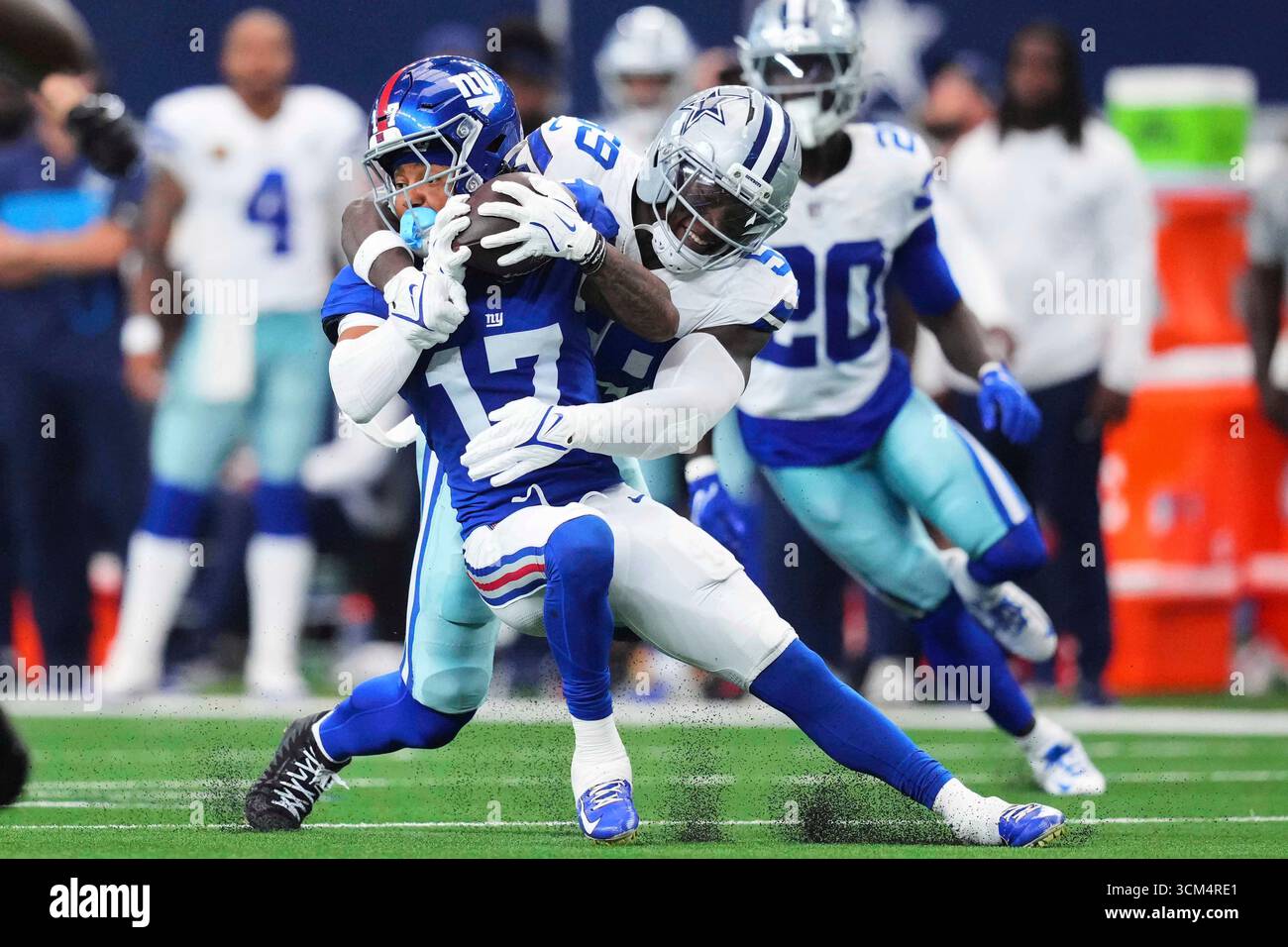 New York Giants' Wan'Dale Robinson (17) is stopped after catching a ...