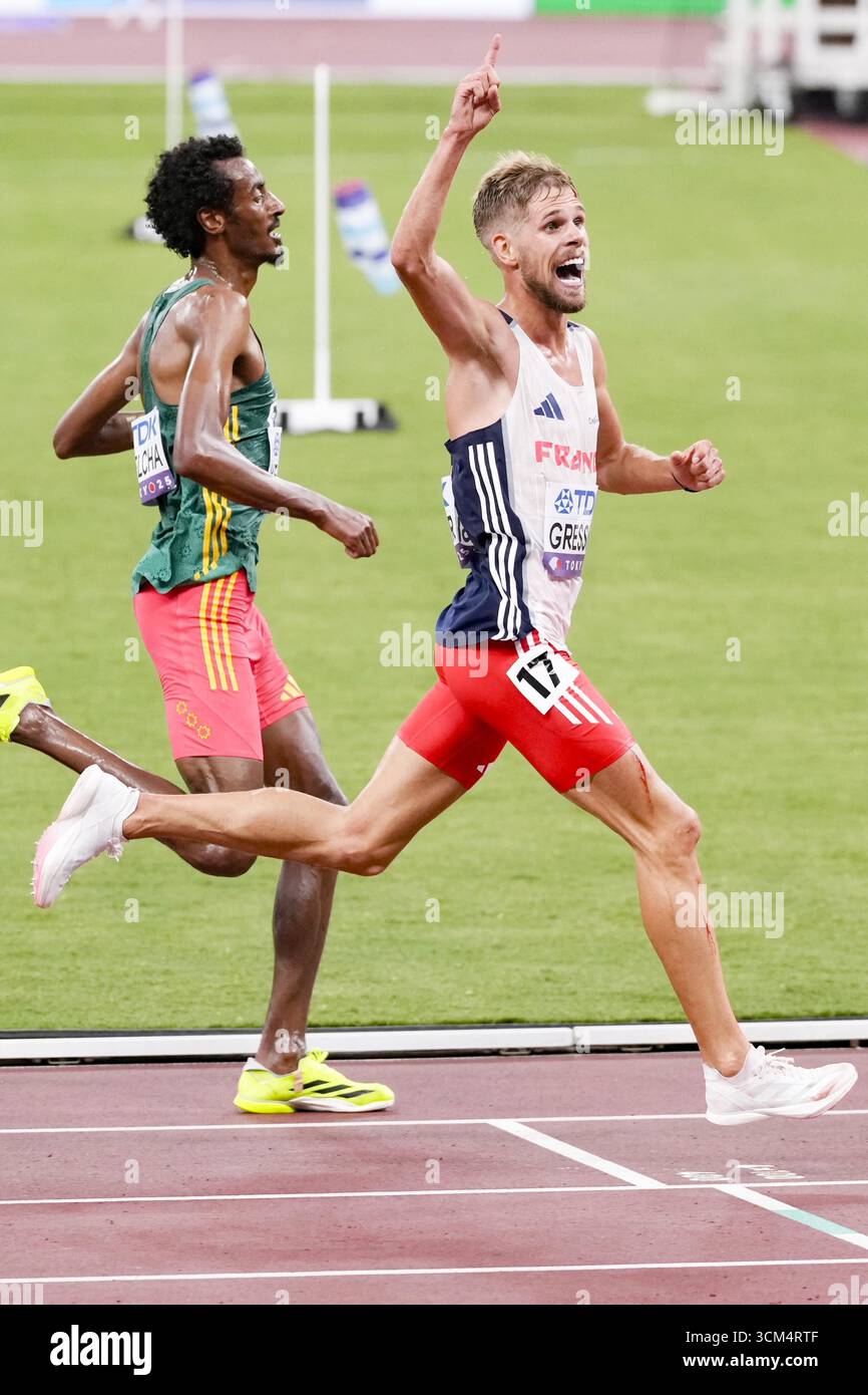 Jimmy Gressier (R) of France reacts after winning the men's 10,000 ...