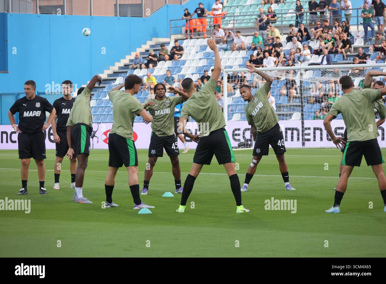Sassuolo’s players warm up before the Serie A Unilive soccer match between U.S Sassuolo and S.S ...