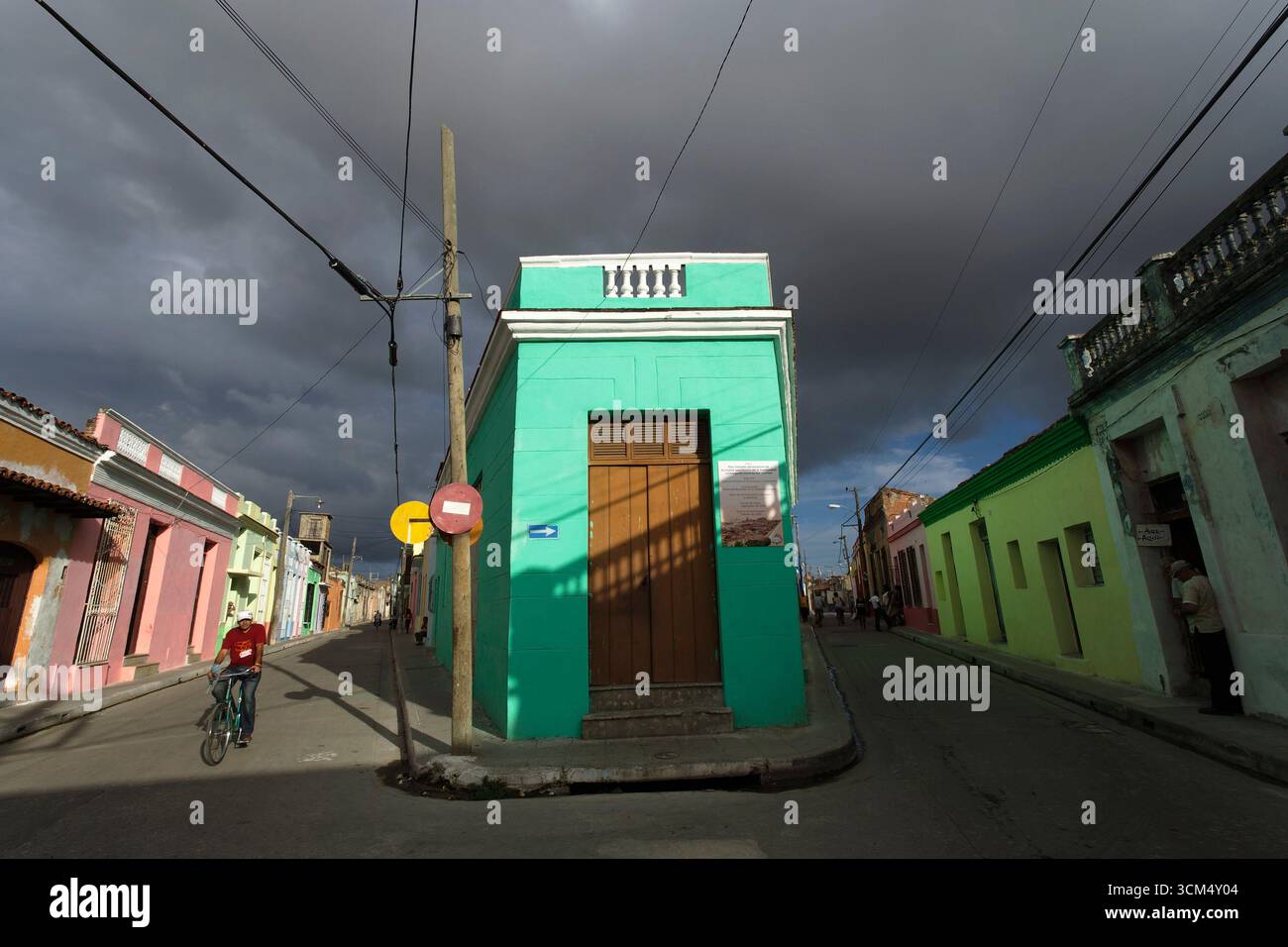 Cyclist in narrow street hi-res stock photography and images - Alamy
