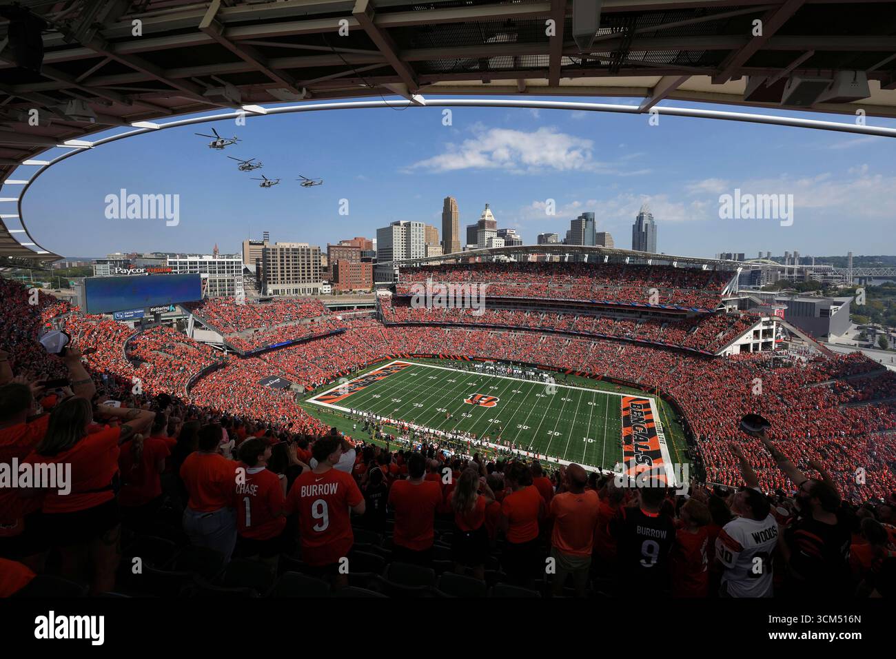 Helicopters are seen over a general view of Paycor Stadium before an ...