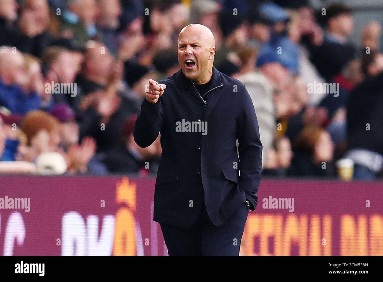 Liverpool manager Arne Slot gestures on the touchline during the ...