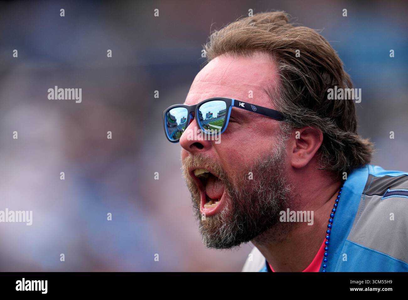 A Tennessee Titans fan yells during the second half of an NFL football ...