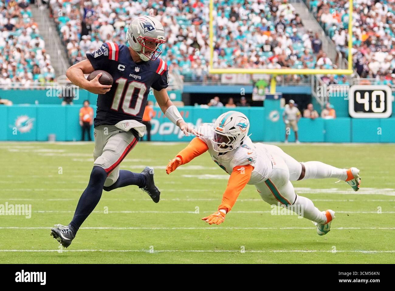 New England Patriots' Drake Maye gets past Miami Dolphins' Matthew ...