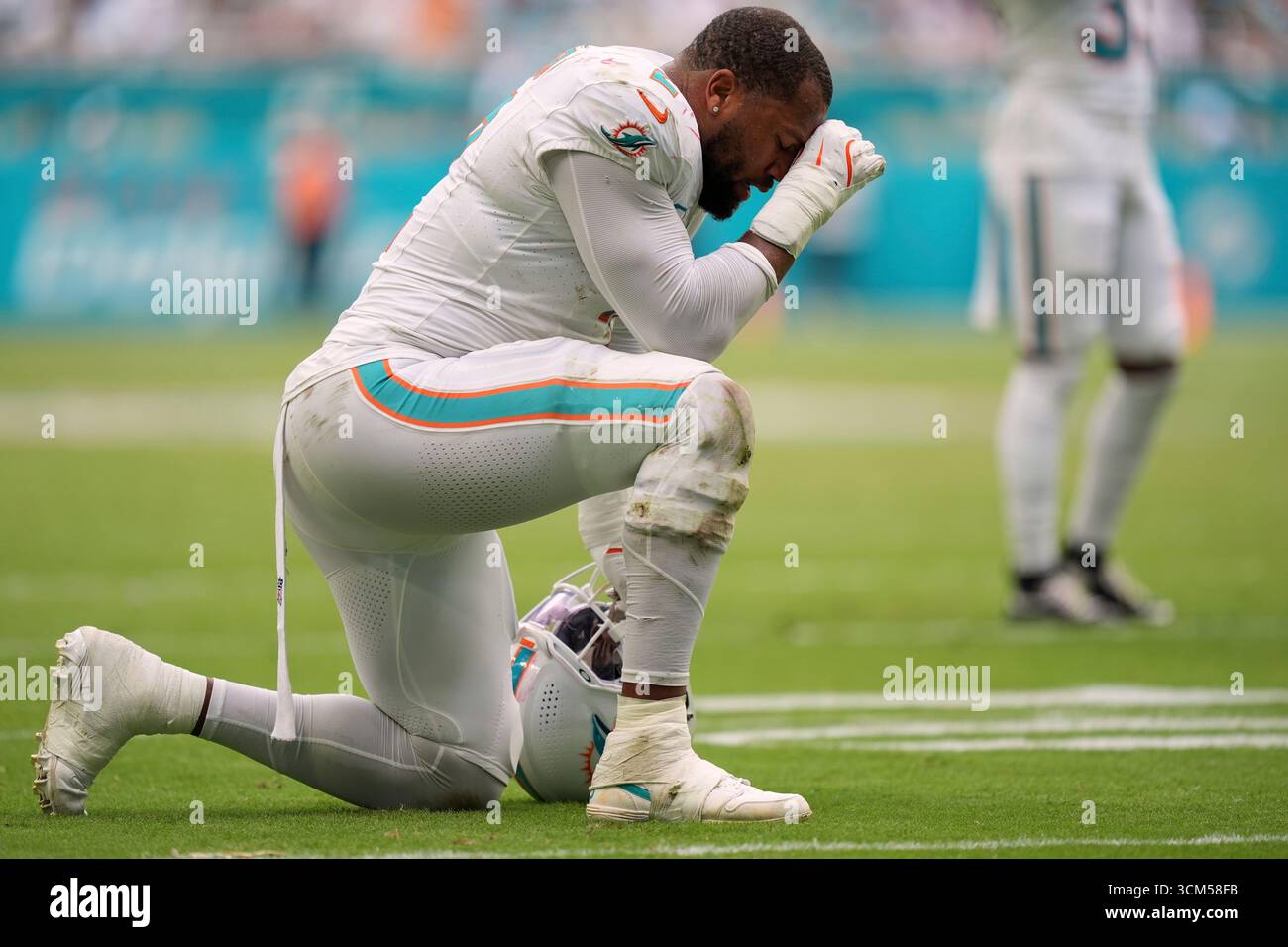 Miami Dolphins' Bradley Chubb reacts after teammate Chop Robinson is ...
