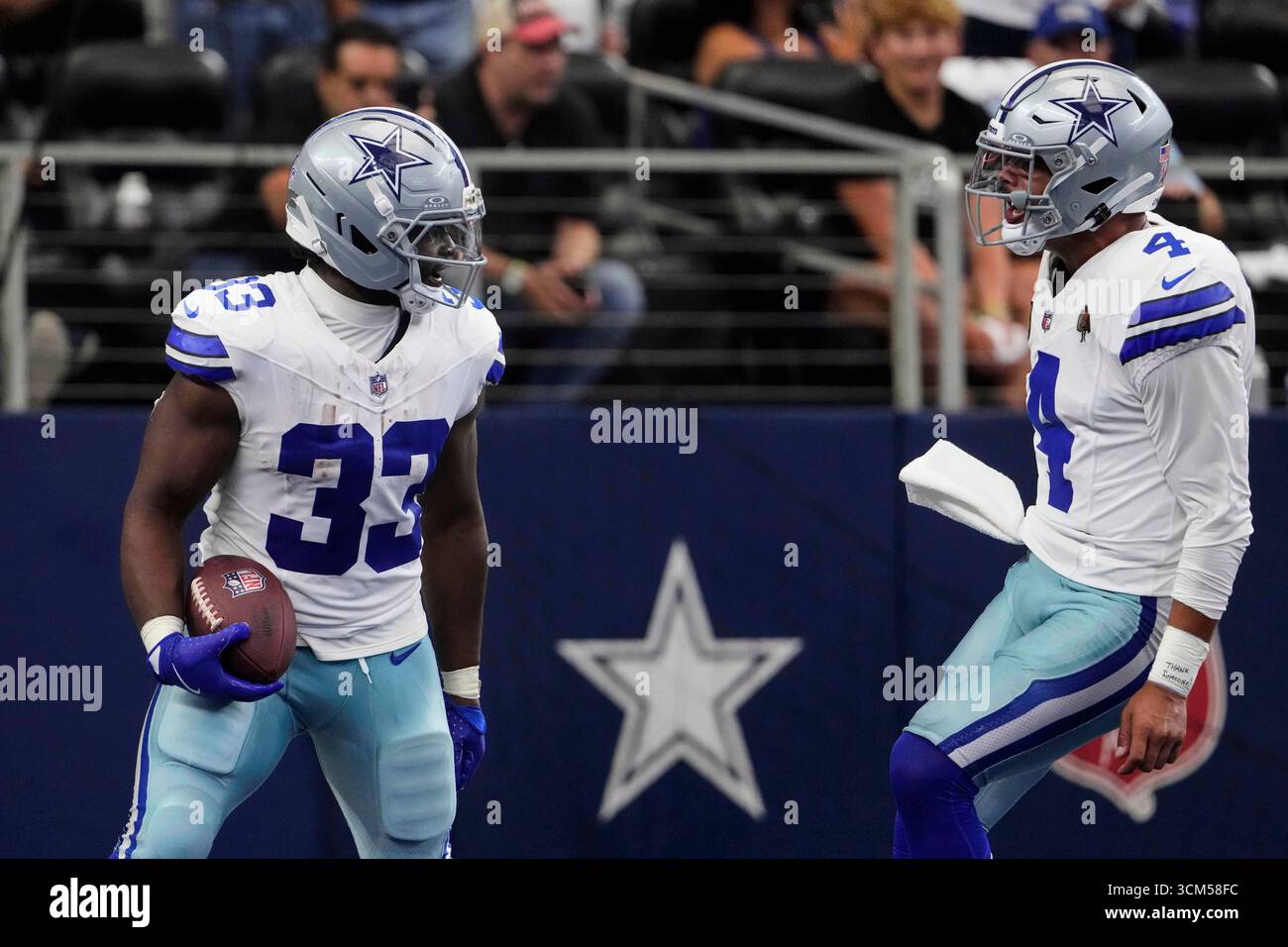 Dallas Cowboys' Javonte Williams (33) and Dak Prescott (4) celebrate ...