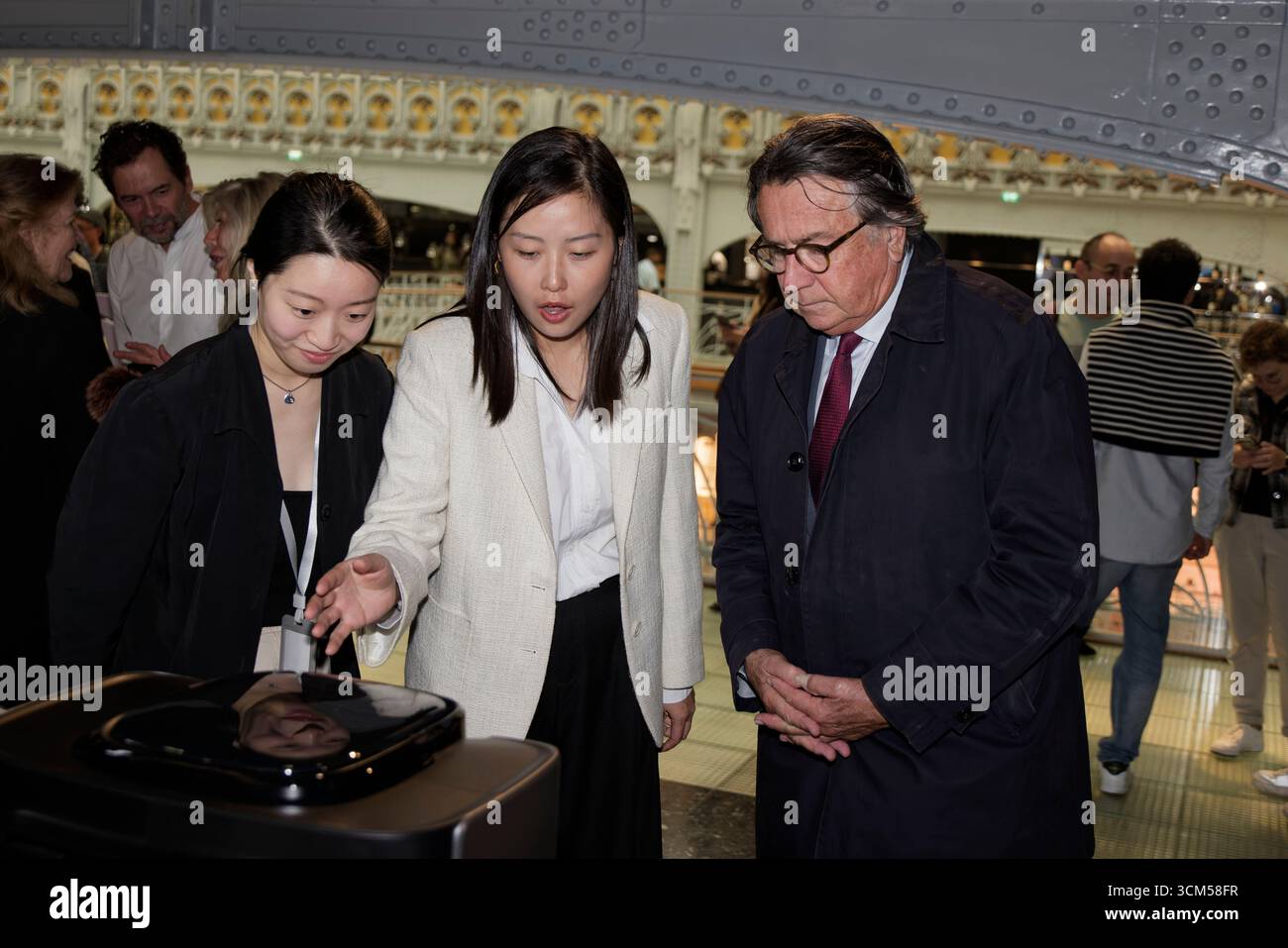 Paris, France. 14 Sep, 2025. A guest, CEO 3i Ye Yu and Philippe Couperie-Eiffel attend the ...
