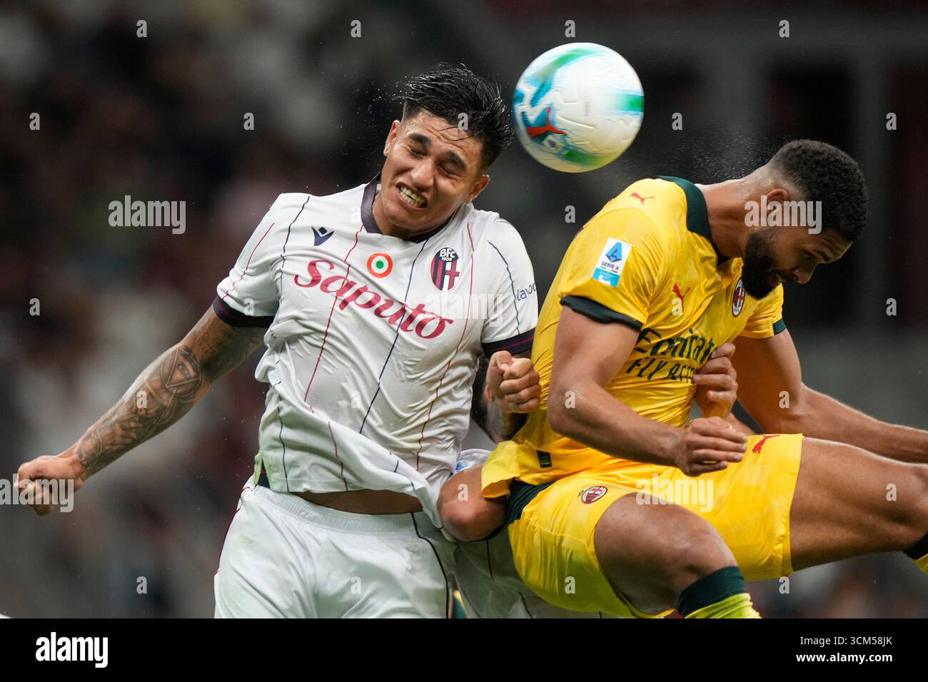 AC Milan's Ruben Loftus-Cheek, right, and Bologna's Santiago Castro ...