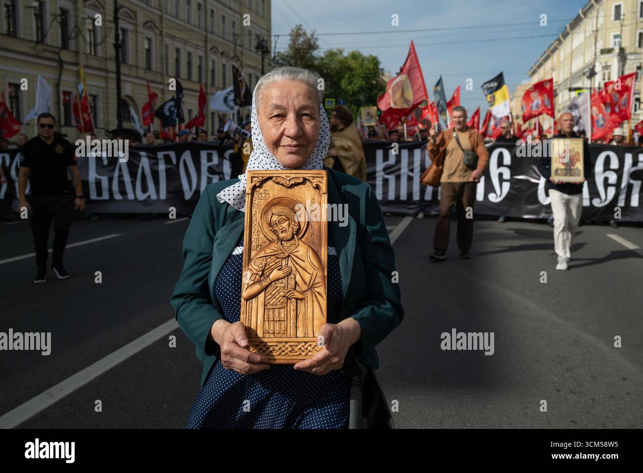 An Orthodox believer holding a wooden icon takes part in a religious ...