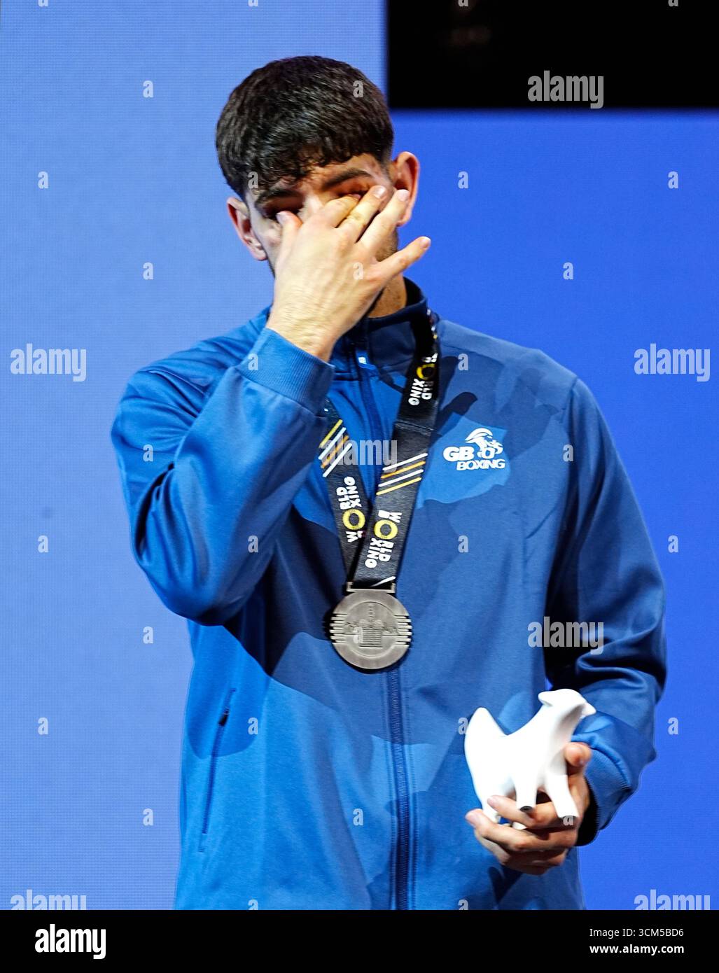 England's Teagn Stott with the silver medal for the Men's 85kg during ...