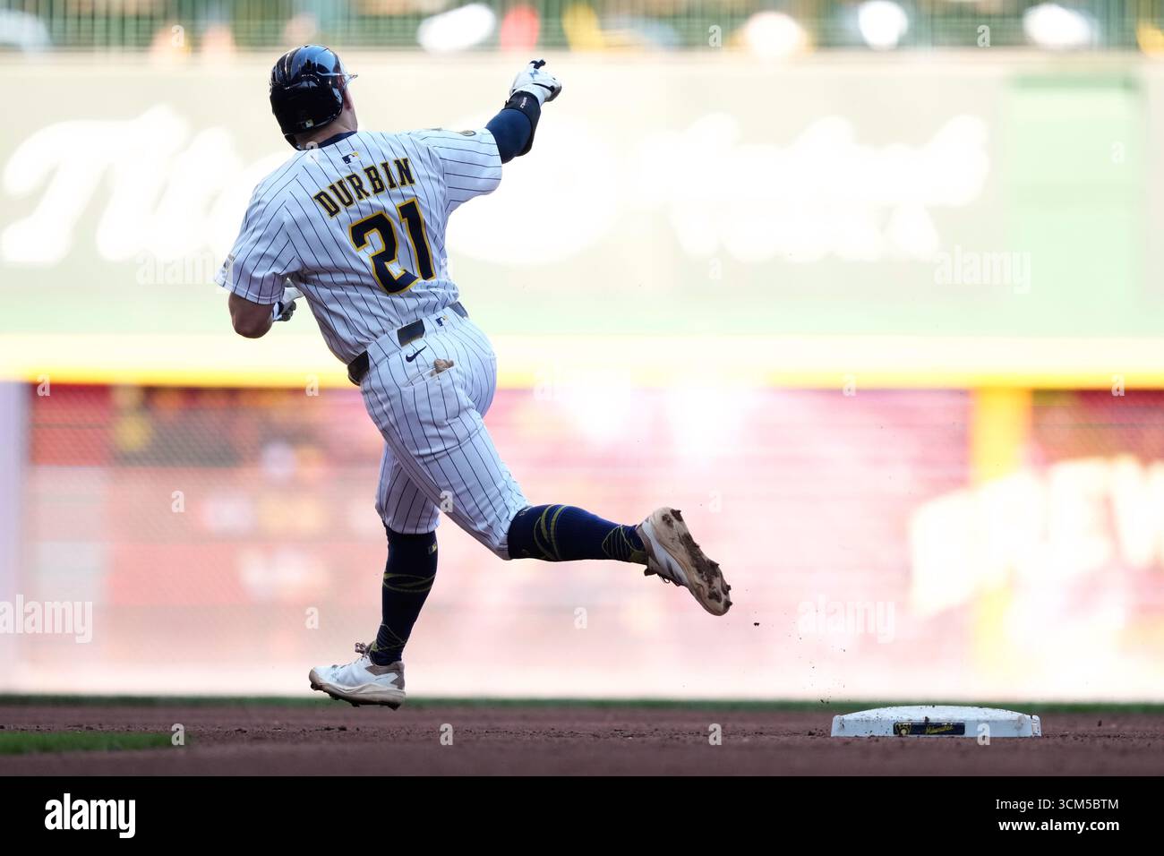 Milwaukee Brewers' Caleb Durbin rounds the bases after hitting a solo ...