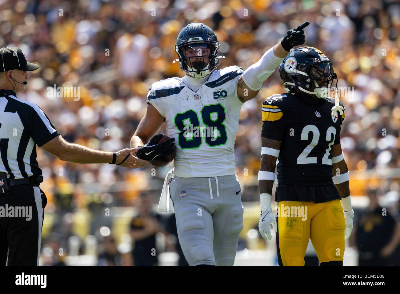 Seattle Seahawks tight end AJ Barner (88) signals for a first down ...