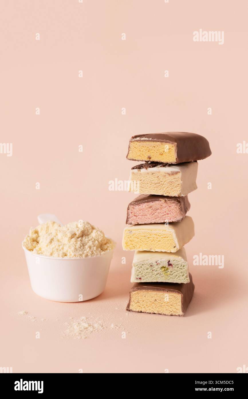 Different whey protein bars with various coatings and sprinkles scoop ...