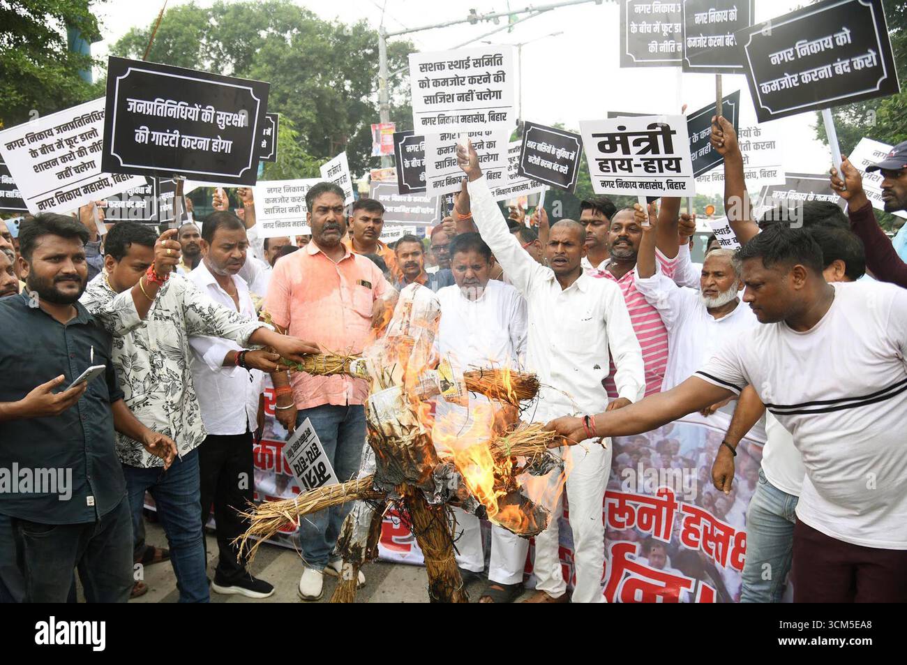 PATNA, INDIA - SEPTEMBER 13: Members of Nagar Nikay Mahasangh burning ...