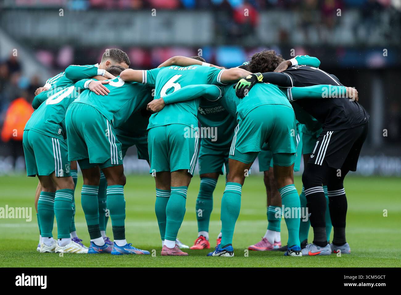 Liverpool team huddle during the Premier League match Burnley vs ...