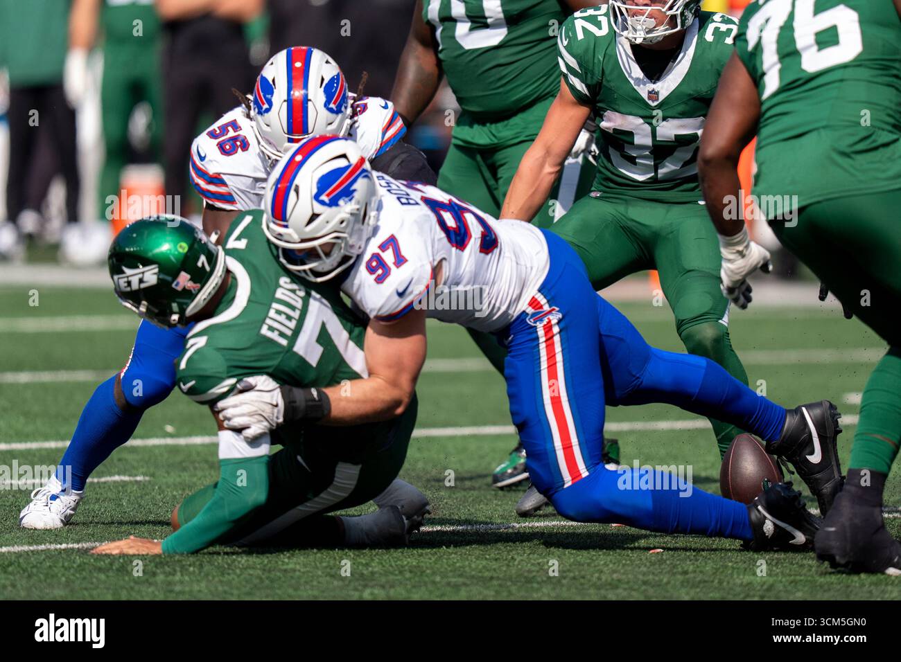 New York Jets quarterback Justin Fields (7) gets taken down by Bufalo ...