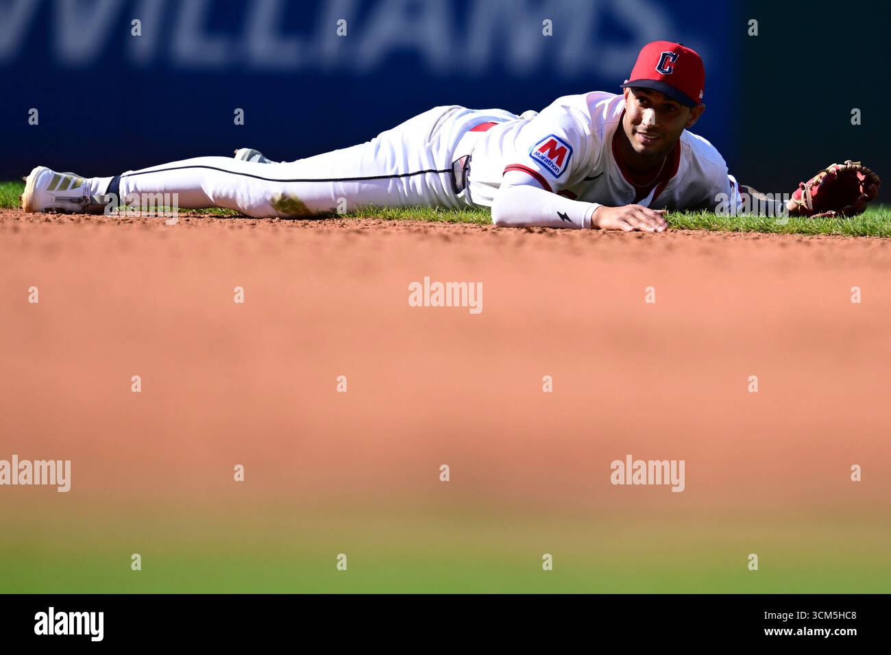 Cleveland Guardians second basemen Brayan Rocchio smiles after throwing ...