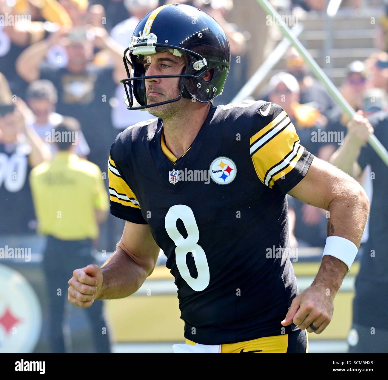 Pittsburgh Steelers quarterback Aaron Rodgers (8) runs on to the field ...