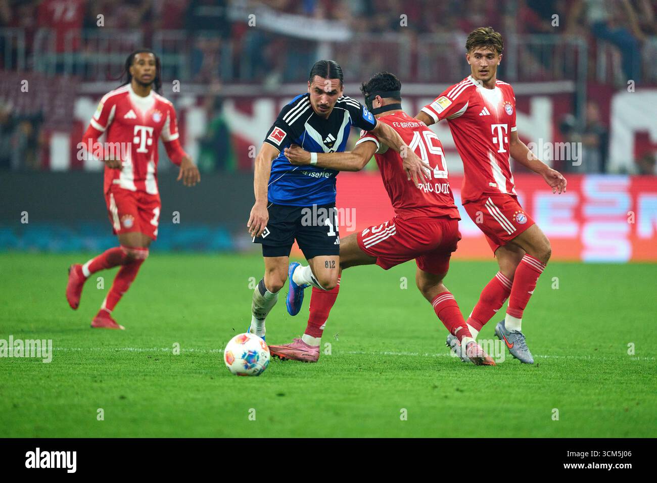 Rayan Philippe of Hamburg compete for the ball, tackling, duel, header ...