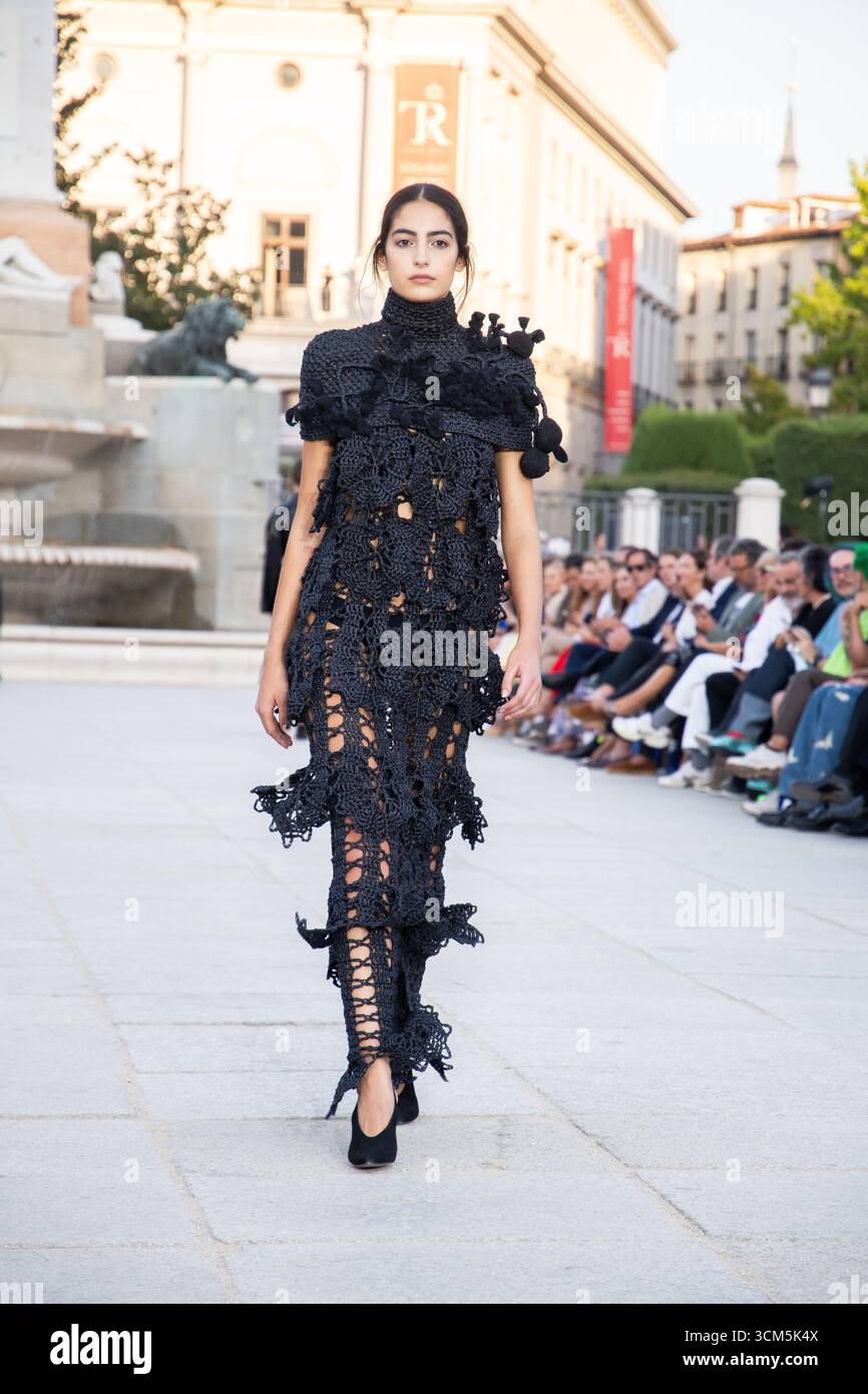 A model walks the runway wearing a design by Madrid es Mode during ...