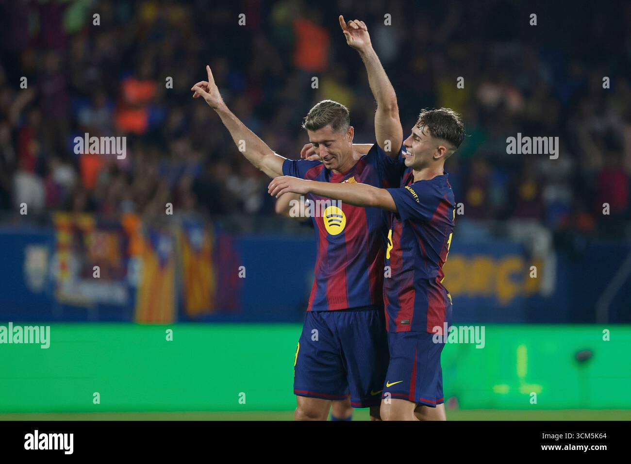 Barcelona's Robert Lewandowski, left, celebrates after the VAR ...