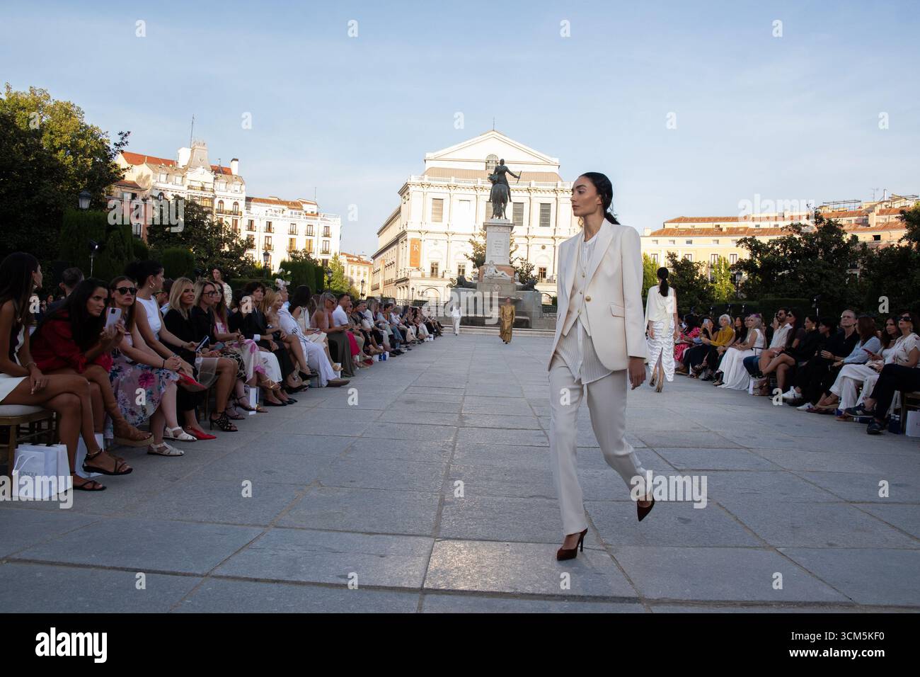 A model walks the runway wearing a design by Madrid es Mode during ...