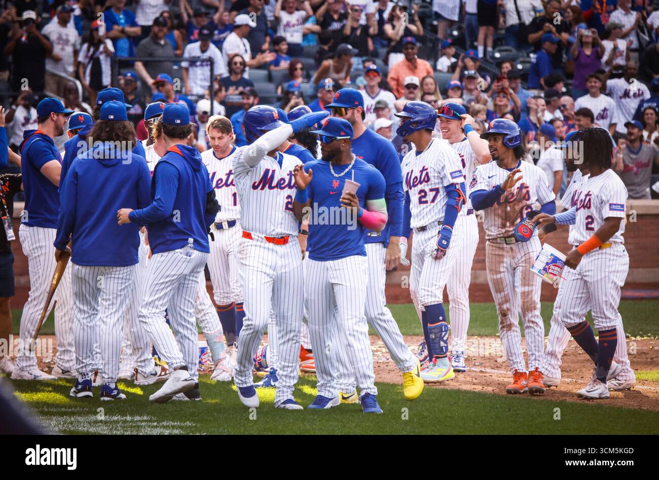 New York Mets players celebrate after winning a baseball game against ...