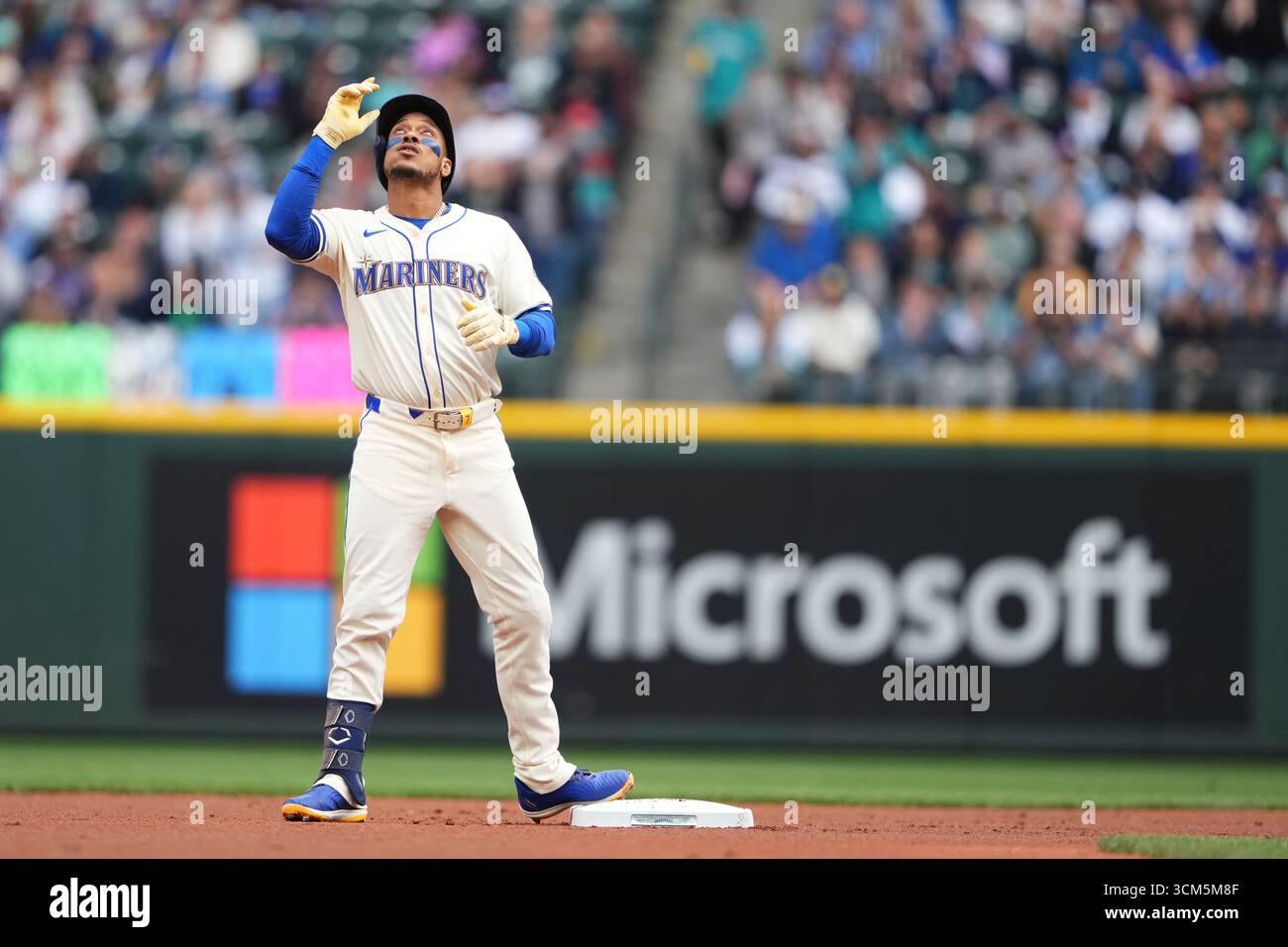 Seattle Mariners designated hitter Jorge Polanco reacts after hitting a ...